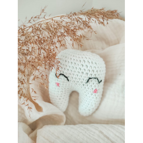 Dent en crochet pour y glisser la dent de votre enfant